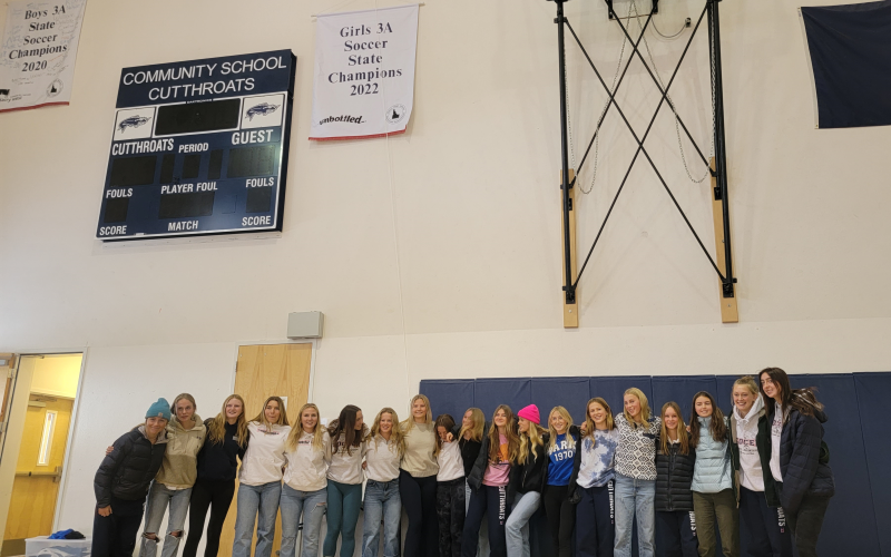 Sun Valley Community School Girls Raise Their Championship Banner