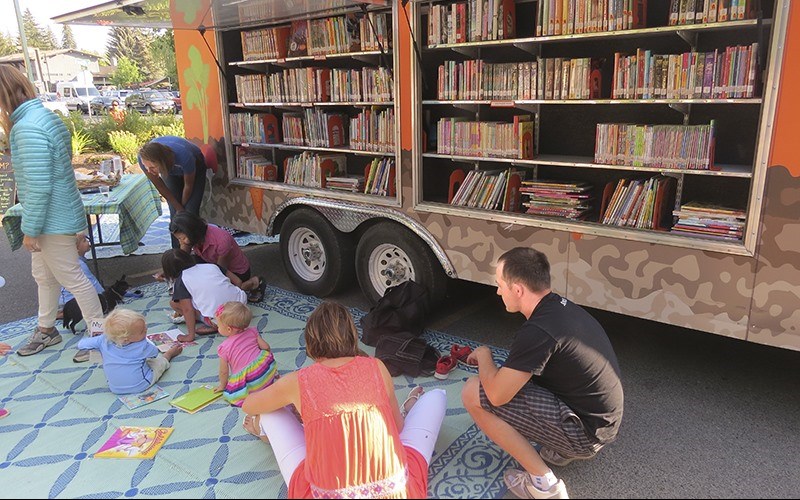 Bookmobile and Bloom Truck Dispense Books, Lunch and Fun